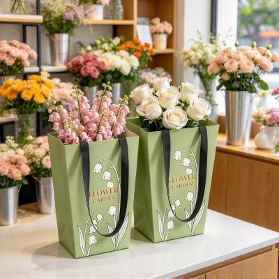 China Biodegradable Paper Bag with Twisted Paper Handles and Gravure Printing for Retail Packaging Paper Carrier Bag for sale