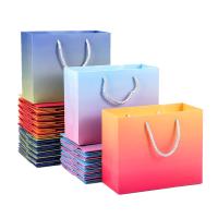 China Custom Hologram Effect Paper Carrier Bags with Ribbon Handle 300gsm for sale
