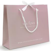 China Custom Printed Paper Carrier Bags 100gsm 128gsm with Ribbon Handle Eco Friendly for sale