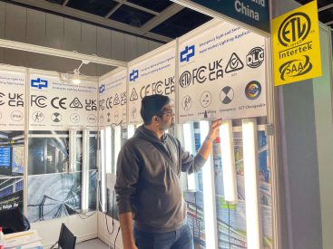 Customers are looking at Comled Limited's lighting products at the Hong Kong International Lighting Fair