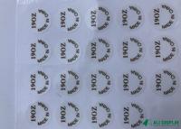 China UV BOPP Adhesive Label Sticker Roll CDR Logo Sticker Paper for sale