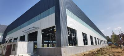 China Prefabricated Steel Warehouse with H-Section Beams and Galvanized Finish for sale