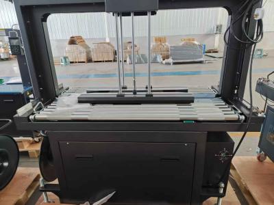 China 1200mm Semi Automatic Pedal Control Box Strapping Machine for Carton Strapping and Carton Binding for sale