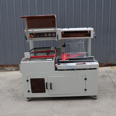 China Stainless Steel Fully Automatic Shrink Wrapping Machine 220V / 50Hz PLC Control for sale