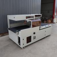 China Stainless Steel Plastic Wrap Packaging Machine Pneumatic Shrink Packing Machine for sale