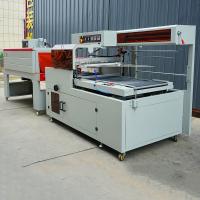 China Stainless Steel PLC Controlled Fully Automatic Shrink Wrapping Machine 220V/50Hz Power Supply for sale