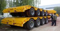 China Titan Lowbed trailer ,4line 8 axle lowbed trailer loading capacity 150tons with 2 line 4 axle dolly for sale