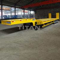 China 4 axle low bed trailer 100 ton  with the hydraulic ramps for sale