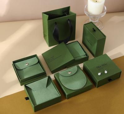 China Batch Customized LOGO Kapok Green Jewelry Storage Drawer Box Velvet Bag Set Light Luxury World Cover Jewelry Packaging Box for sale