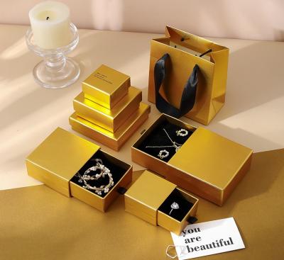 China Wholesale Customizable Gold Jewelry Packaging Box Light Luxury Special Paper Top And Bottom Cover Ring Pull-Out Hard Box Jewelry Storage Drawer Box for sale