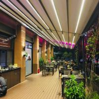 China Industrial Aluminum Patio Cover Retractable LED Sunshade System 110V 220V Motorized Pergola for sale