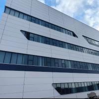 China Q235B/Q355B Prefabricated Steel Warehouse with 30-50 Year Lifespan and Custom Cladding for sale
