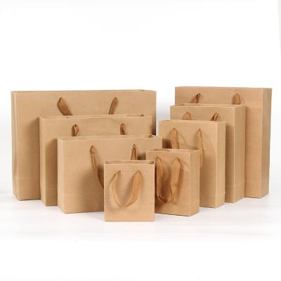 China Antiwear Moistureproof Kraft Paper Gift Bags With Handles Multipurpose for sale