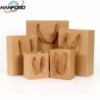 China Antiwear Moistureproof Kraft Paper Gift Bags With Handles Multipurpose for sale