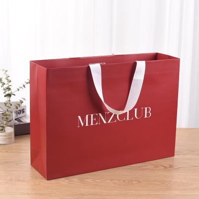 China Ultralight Party Kraft Paper Gift Bags With Handles Biodegradable for sale
