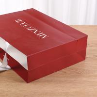 China Ultralight Party Kraft Paper Gift Bags With Handles Biodegradable for sale