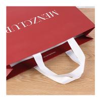 China Ultralight Party Kraft Paper Gift Bags With Handles Biodegradable for sale