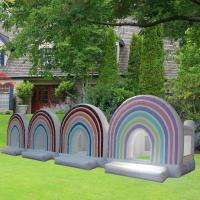 China 2024 Double Slide White Inflatable Bouncer House with Customized Color and Rainbow Theme for sale