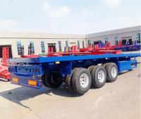 China Truck Trailer Flatbed Semi Trailer With 30-60 Tons Loading Capacity And 1 Tool Box Big Chamber for sale