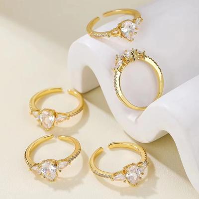 China Jiexing Trendy Finger Rings Wholesale 14K Gold Plated Adjustable Shinny Zircon Micro Set Drop Shape Opening Ring for sale