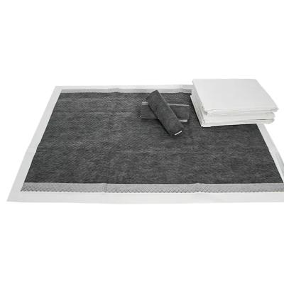 China Disposable Pet Training Pads with Super Absorbent Bamboo Charcoal and Adhesive Sticker for sale