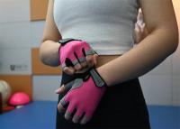 China Pink lightweight half-finger workout gloves offer comfort and grip during weightlifting sessions. for sale