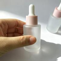 China Essential Oil Frosted Flat Shoulder Glass Dropper Bottle 30ml Customized for sale