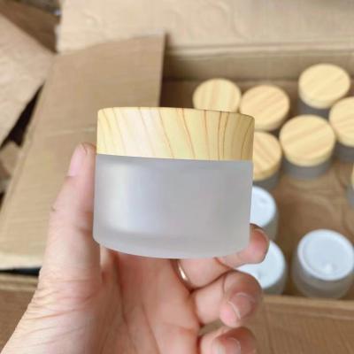 China BONA 50g 100g Glass Cosmetic Jar With Bamboo Lid Cap OEM / ODM for sale