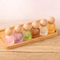 China 10g Glass Perfume Bottle With Round Wooden Cap For Car Air Freshener Bottle Packaging for sale