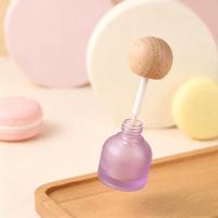 China 10g Glass Perfume Bottle With Round Wooden Cap For Car Air Freshener Bottle Packaging for sale