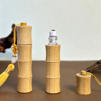 China 10g 15g Bamboo Roll On Bottle With Steel Ball Cosmetic Oil Bottle Packaging for sale