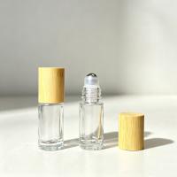 China 5ml 10ml Bamboo Cap Glass Roll On Bottle For Cosmetic Oil for sale
