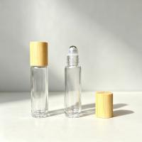 China 5ml 10ml Bamboo Cap Glass Roll On Bottle For Cosmetic Oil for sale