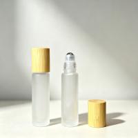China 5ml 10ml Bamboo Cap Glass Roll On Bottle For Cosmetic Oil for sale