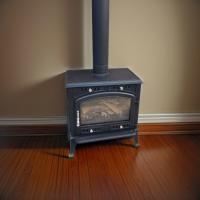 China Assembly Required Wood Burning Fire Pits Cast Iron Construction Indoor Cast Iron Wood Burning Stove for sale