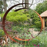 China Rusty Outdoor Corten Steel Sculpture Line Cross Shape Rustic Rings Garden Centerpiece for sale