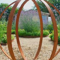 China Rusty Outdoor Corten Steel Sculpture Line Cross Shape Rustic Rings Garden Centerpiece for sale