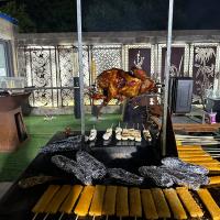 China Heavy Duty Red Rusty Corten Steel BBQ Grill With Automatic Ratating Chicken Rack for sale