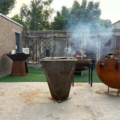 China Outdoor Corten Steel BBQ Grill With Wood Storage And Natural Rusty Surface for sale
