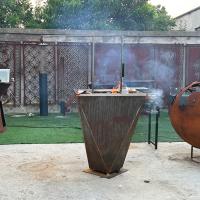 China Outdoor Corten Steel BBQ Grill With Wood Storage And Natural Rusty Surface for sale