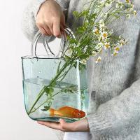 China Wedding Home Decor Modern Glass Handbag Vase Perfect for Fresh Flowers Goldfish for sale