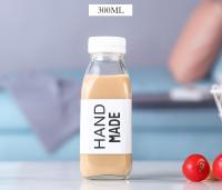 China 300ML Glass Milk Bottles with Plastic Caps Food Grade Glass Bottles for Honey Sauce for sale