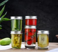 China Glass Canning Jars With Metal Airtight Lids Measurement Marks For Canning Preserving Overnight Oats Jars for sale