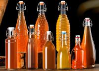 China Clear And Leak Proof Mini Liquor Bottles With Convenient Storage Swing Top Glass Bottles For Beverages Oils Kombucha for sale