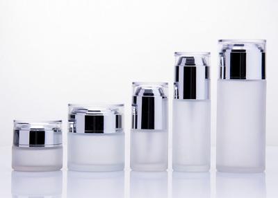 China Round Cosmetic Glass Bottles / Glass Lotion Bottles With Pump for sale