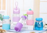 China 300ml Glass Drinking Bottles With Silicone Cover Eco Friendly Feature for sale