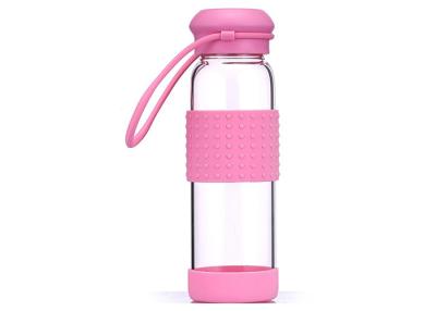 China Round Glass Drinking Bottle With Silicone Sleeve Heat Resistant Feature for sale