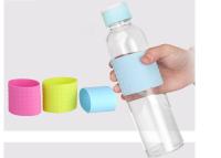 China Round Glass Drinking Bottle With Silicone Sleeve Heat Resistant Feature for sale