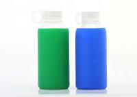 China Blue Glass Water Bottle With Silicone Sleeve Heat Resistant Feature for sale