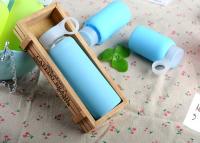 China Blue Glass Water Bottle With Silicone Sleeve Heat Resistant Feature for sale